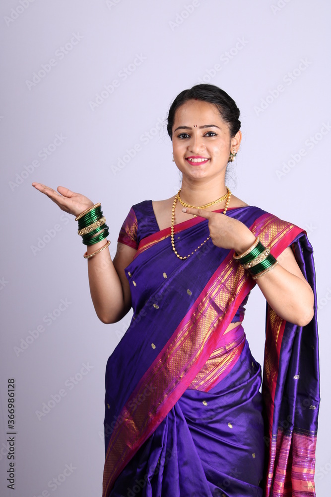 Beautiful Indian girl wearing sari showing hand gestures. Stock Photo ...