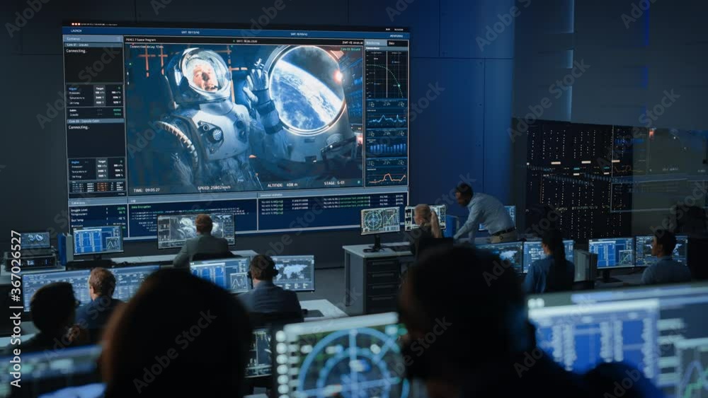 Group of People in Mission Control Center Establish Successful Video ...