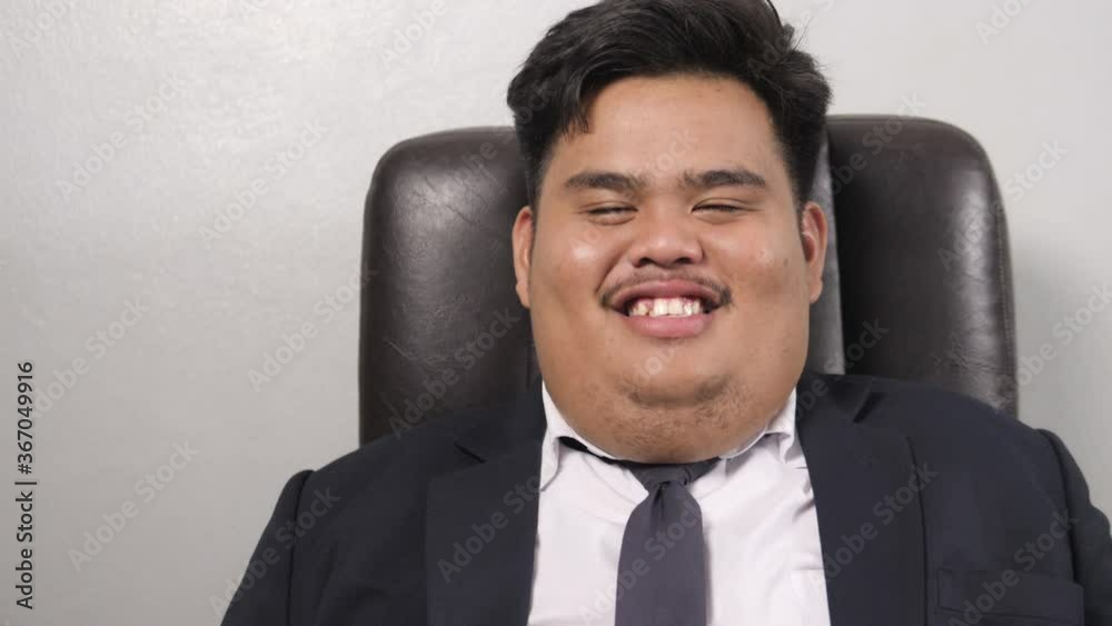 A funny Asian fat business man wearing a suit like the head of ...