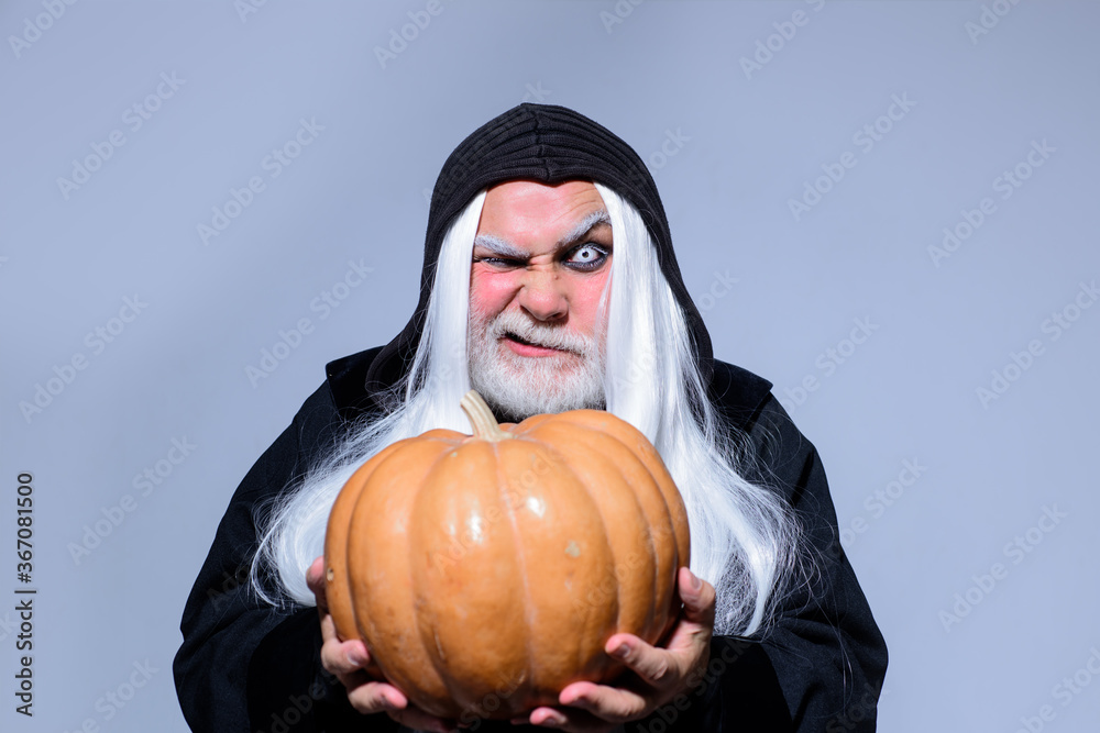 Devil vampire man. Happy Halloween. Evil wizard hold orange pumpkin ...