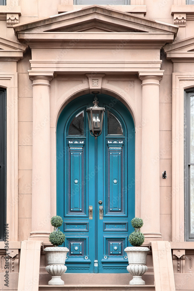 Double azure wooden vintage entry door decorated with fronton and ...