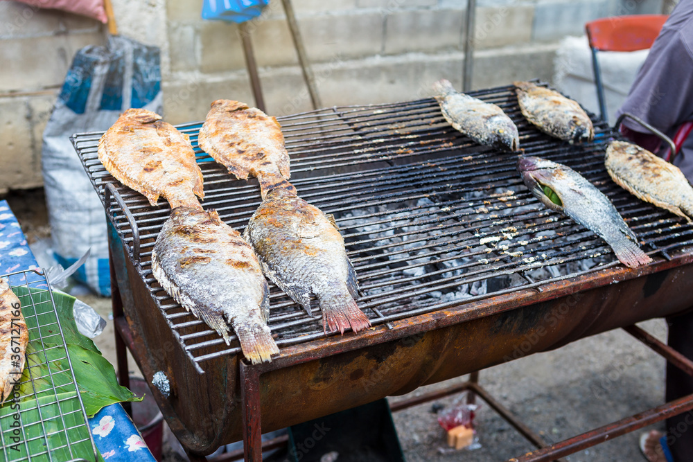 Grill fish at food market in Thailand, Thai style grill fish filled ...