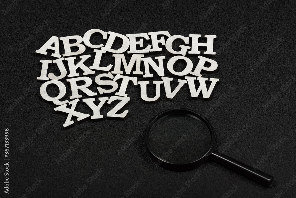 Latin letters in alphabetical order from A to Z. Black background ...