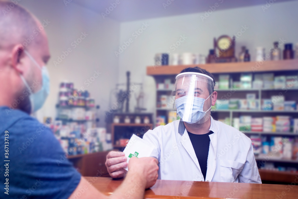 Pharmacist working. Protection in pharmacies. Working in an Alarm State ...