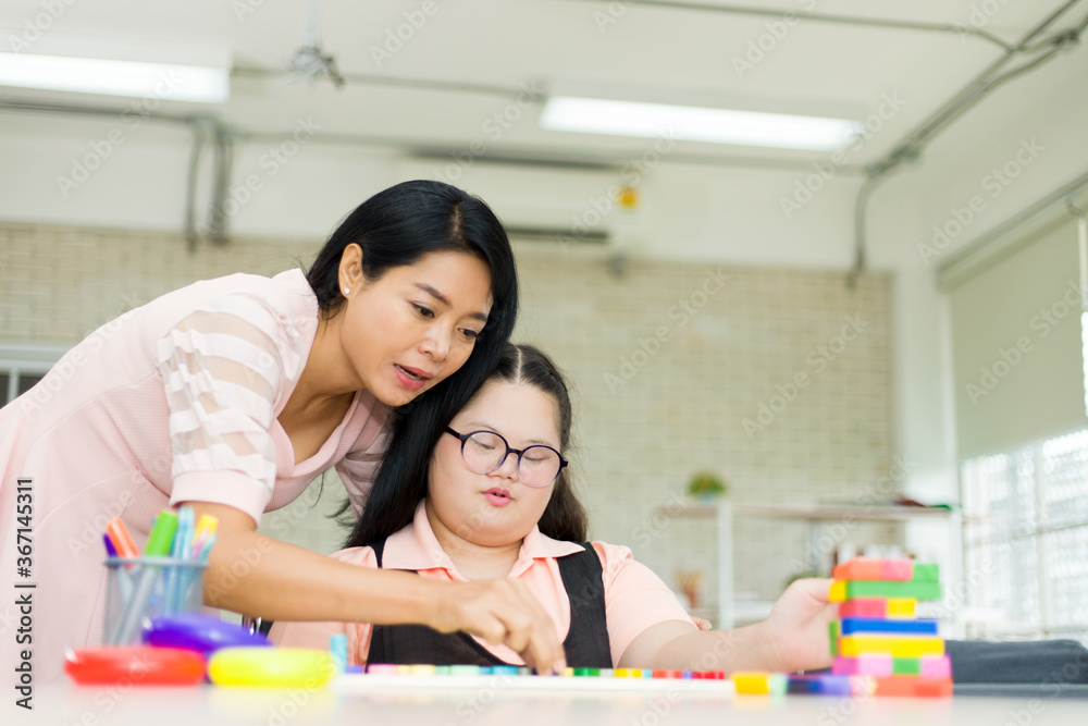 Autistic girl practicing learning development at home. Stock Photo ...