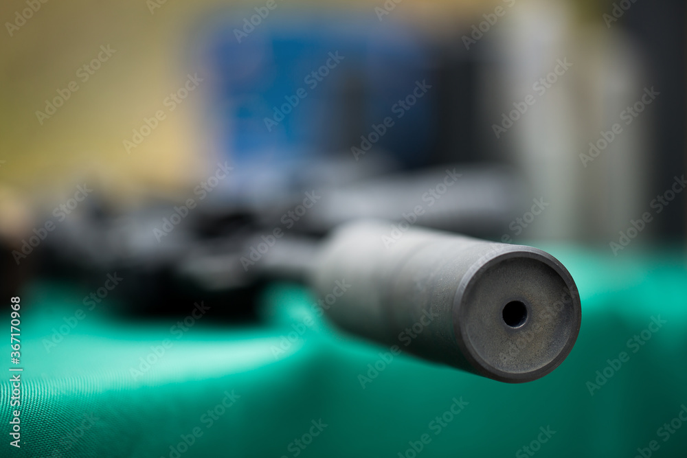Assault rifle with silencer Stock Photo | Adobe Stock