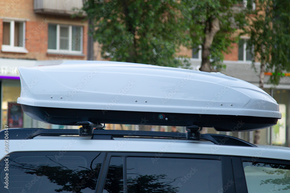 The trunk on the car roof to transport goods. Stock Photo | Adobe Stock
