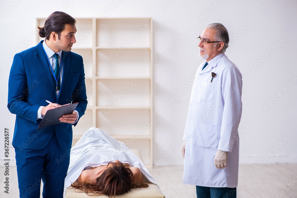 Police coroner examining dead body corpse in morgue Stock Photo | Adobe ...