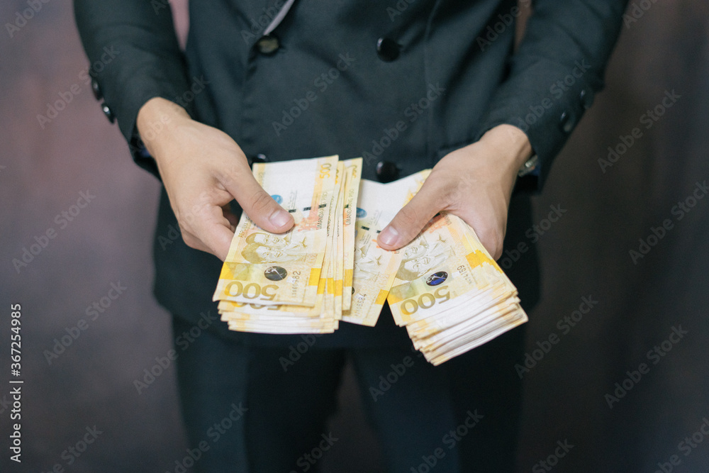 Portrait of a Successful Business Man Counting a lot of Philippine ...