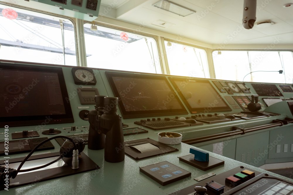 Control room of cargo ship on the top bridge for navigation at sea ...