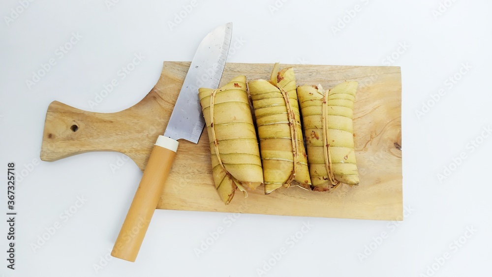 Lepet or leupeut Indonesian traditional food with glutinous rive and ...