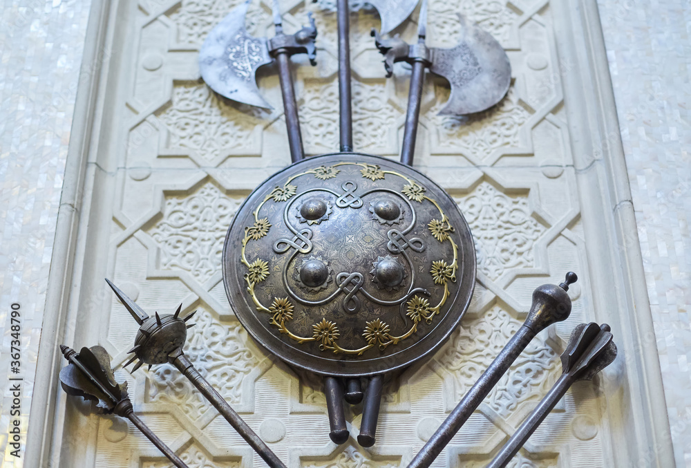 Ancient Eastern shield, axes and pikes from the middle ages, imitation ...