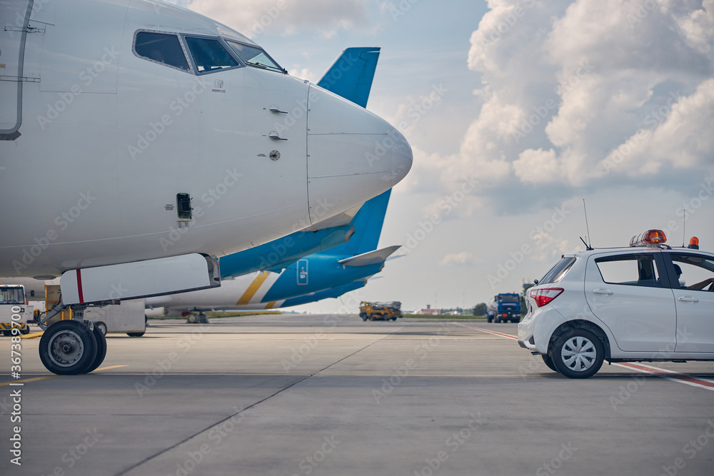 Ground vehicle leading the newly arrived plane Stock Photo | Adobe Stock