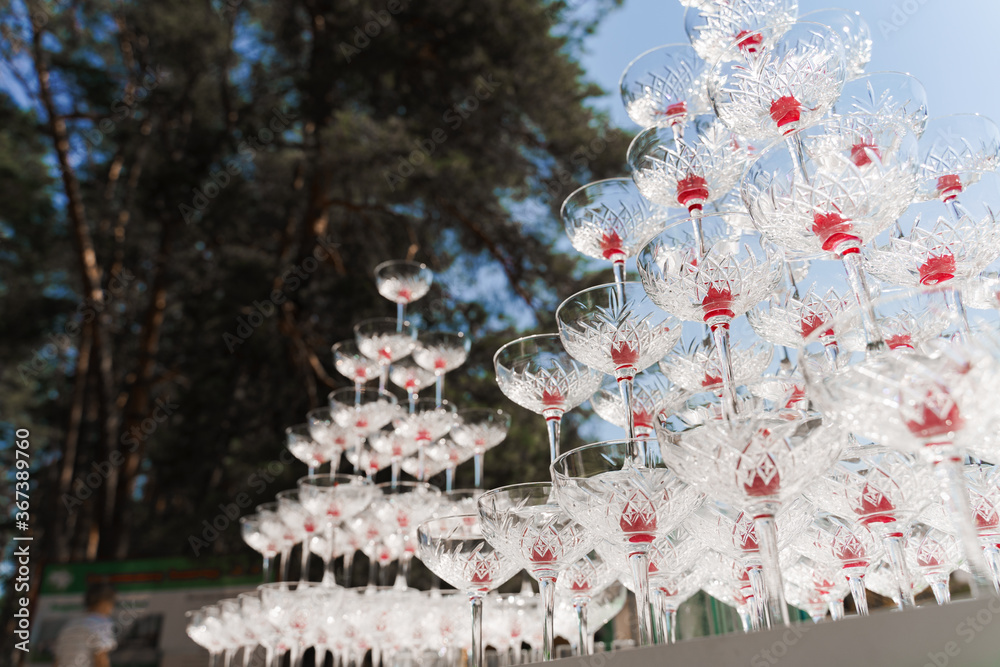 Wine glasses in pyramid of champagne. Drink catering for wedding ...