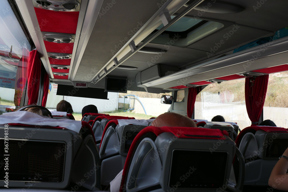 the interior of the passenger bus on the move, the passenger and seats ...