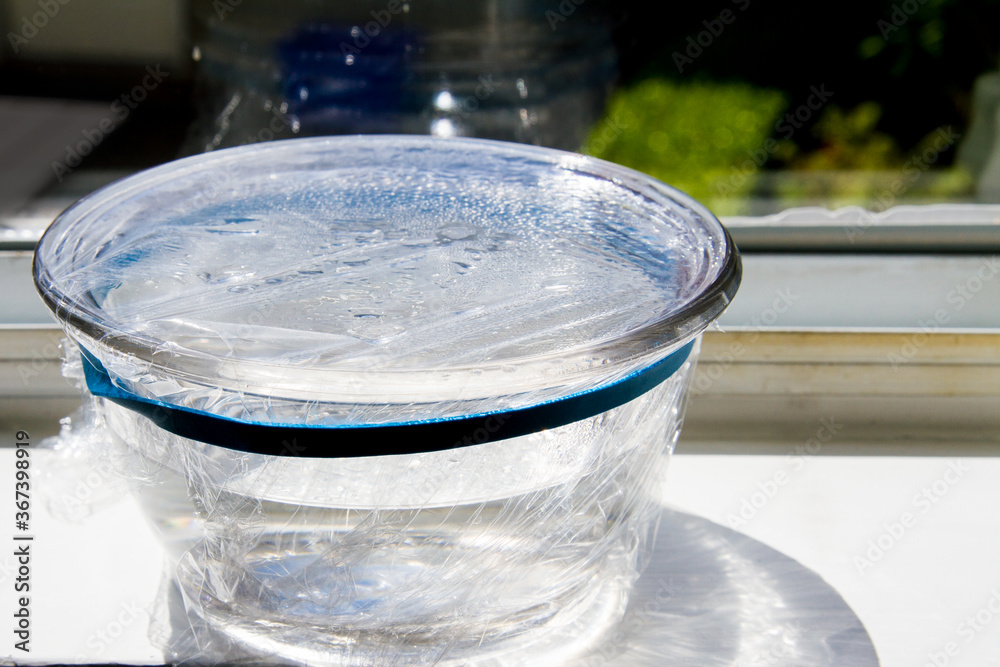 Simple experiment discovering the water cycle; Precipitation ...