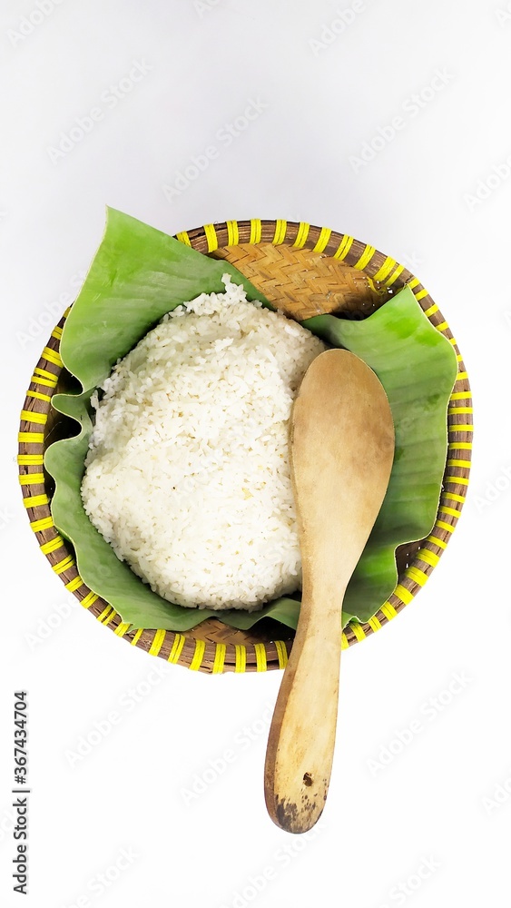 Nasi bakul or rice on Indonesian traditional rice basket from banana ...