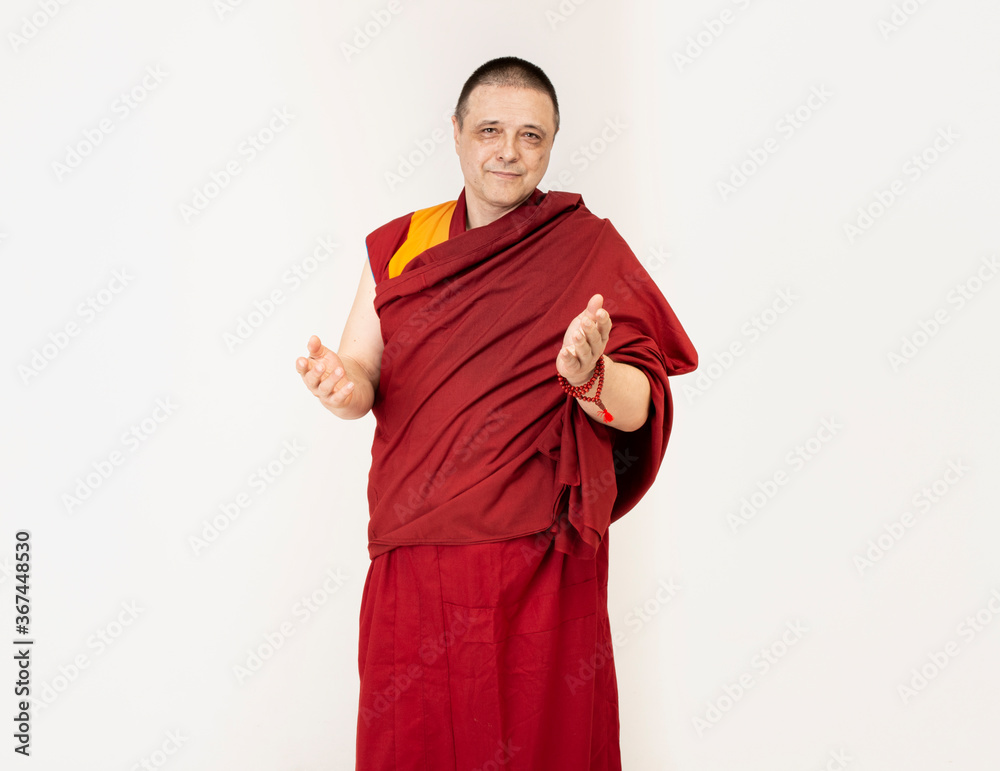 portrait of a Buddhist monk in a ritual red kesa robe for ceremonies ...