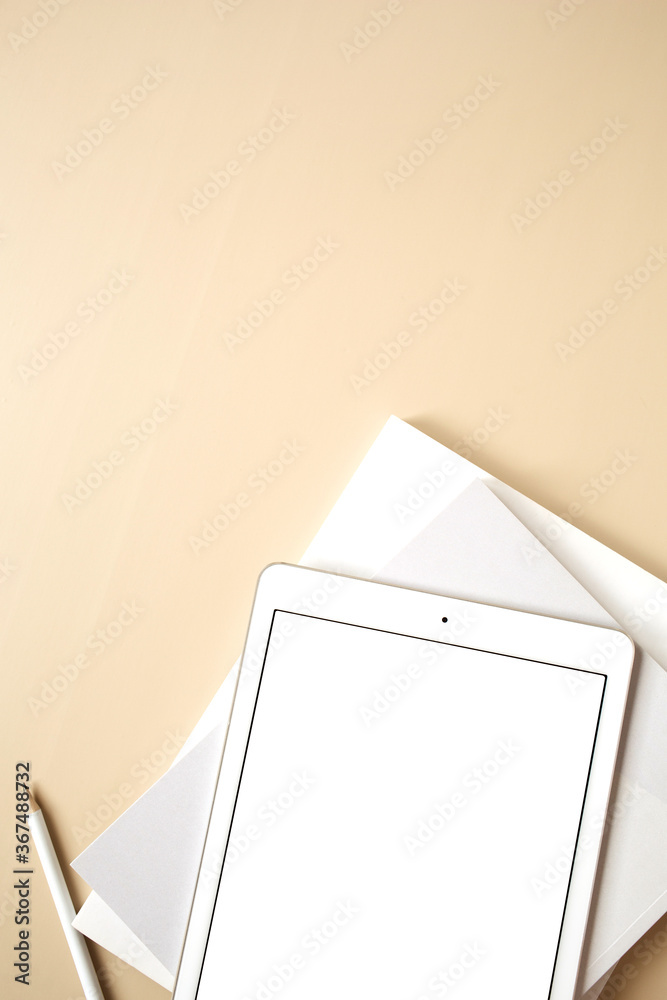 Tablet pad with blank touch screen on neutral beige background. Flat ...