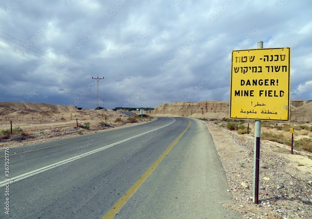 "Danger! Mine field" sign in English, Hebrew and Arabic languages on ...