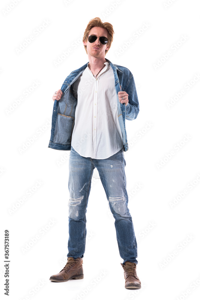 Serious confident macho red hair man with sunglasses posing in jeans ...
