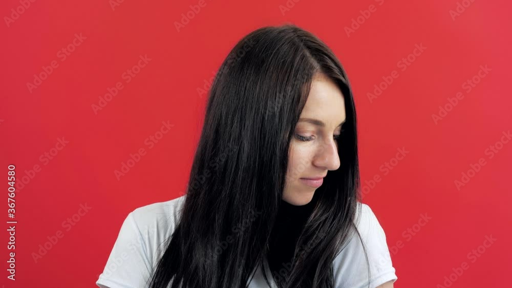 Shy woman in red studio isolated. Portrait of shame girl embarrassed ...