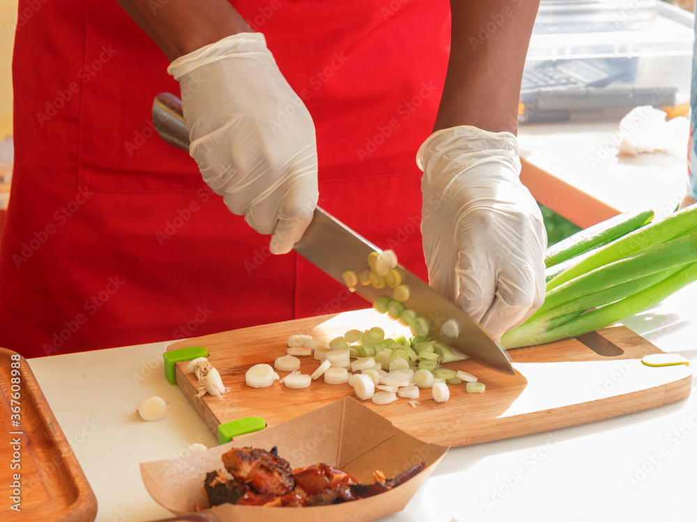 Chef cuts onion and other vegetable at farmers street food market at ...