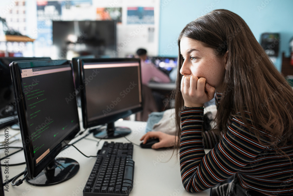 High school girl student using computer in classroom Stock Photo ...
