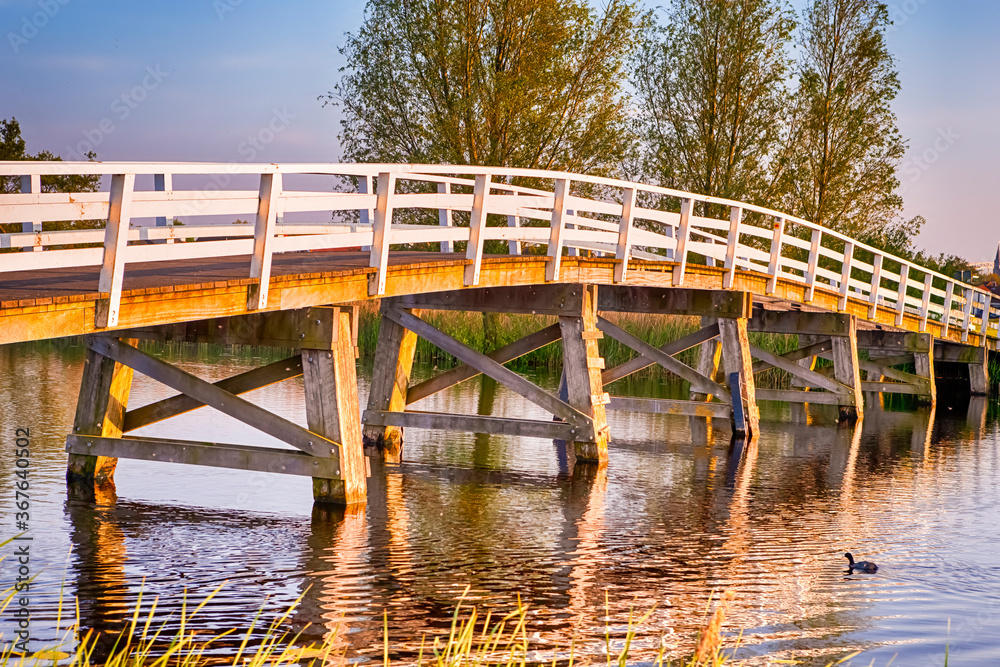 Traditonal Wooden Dutch Bridge in Kinderdijk Village in the Netherlands ...