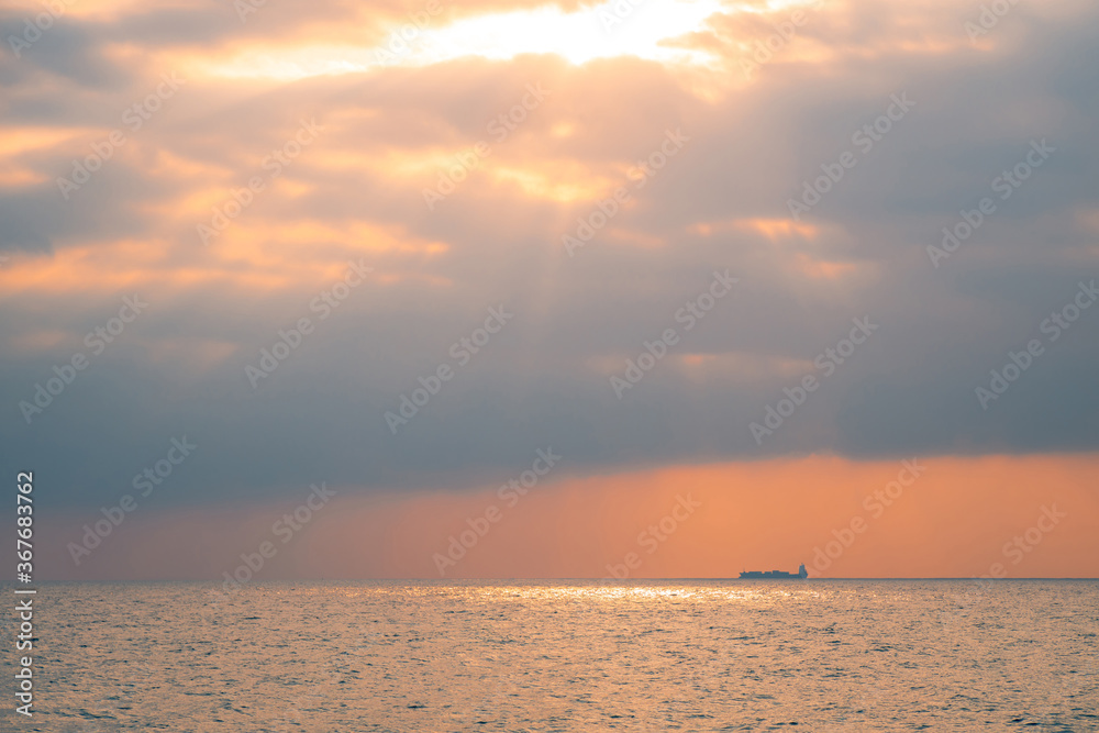 Beautiful ocean sunset over Indian ocean. Container cargo ship ...