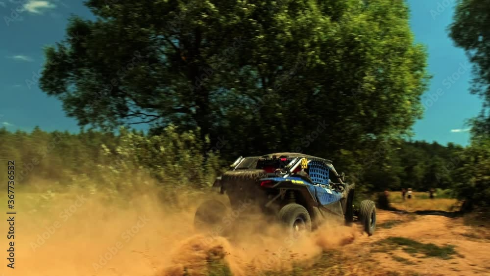 Buggy car going fast in cross country road. Fast rally auto is going ...