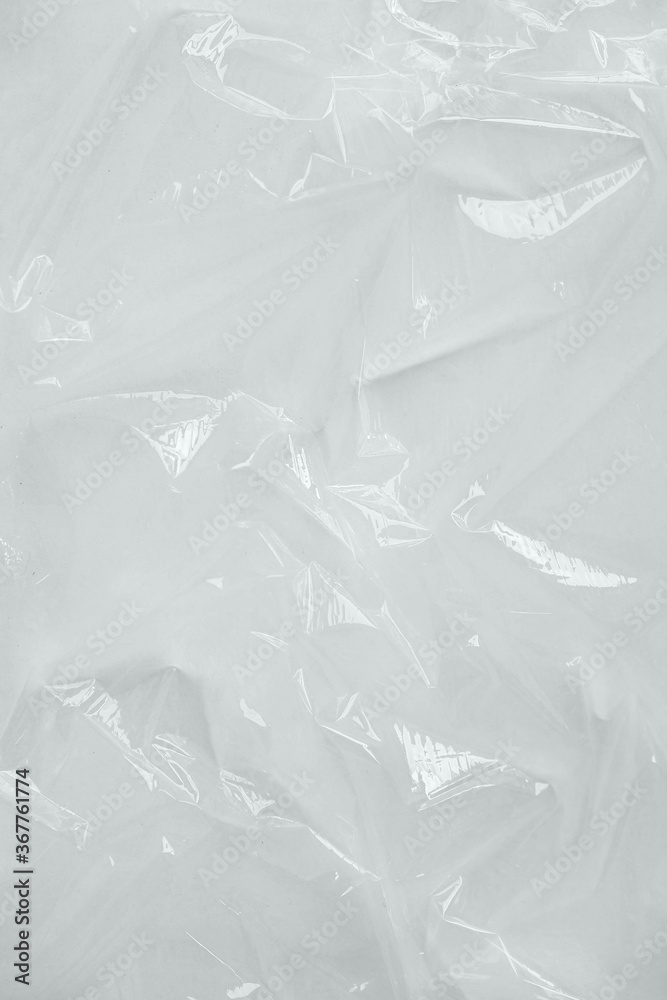 Wrinkled transparent plastic texture on a white background. Transparent ...