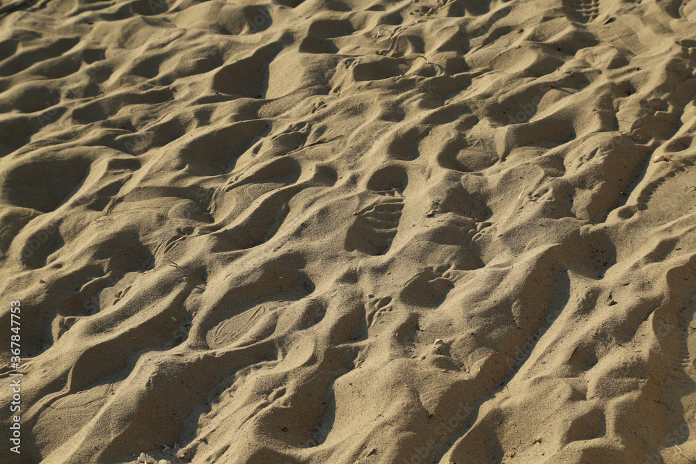 sand texture background random footprints in the sand Stock Photo ...