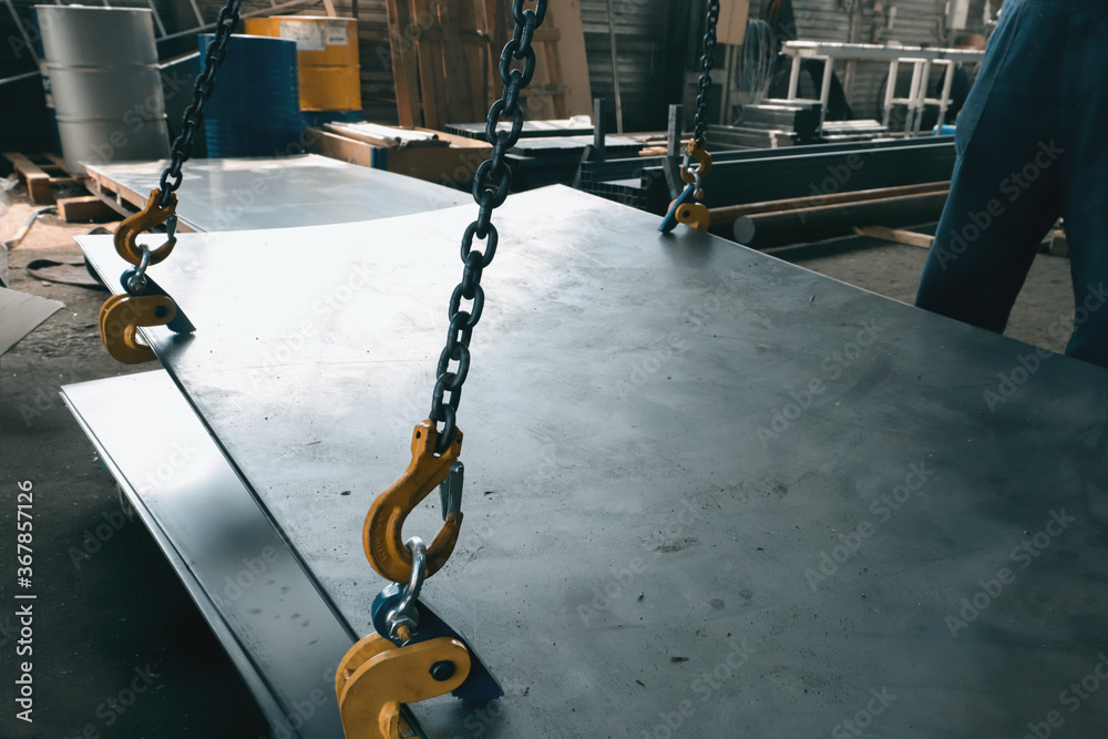 Clamps for moving sheet metal. Unloading sheet metal in the factory ...