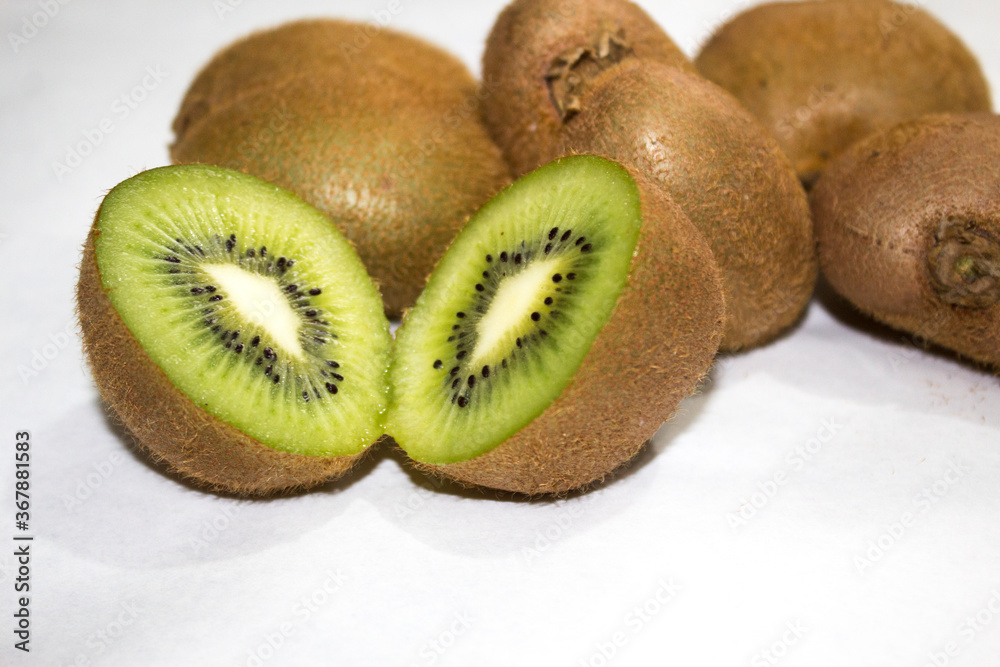 collection Whole kiwi fruit and his sliced segments isolated on white ...