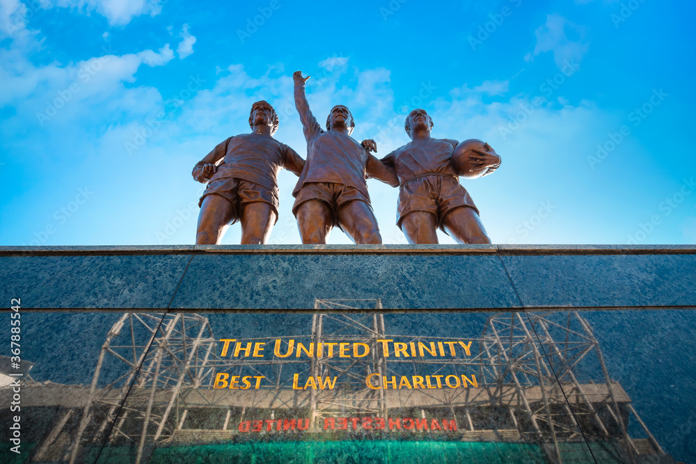 Manchester, UK - May 19 2018: The United Trinity bronze sculpture which ...