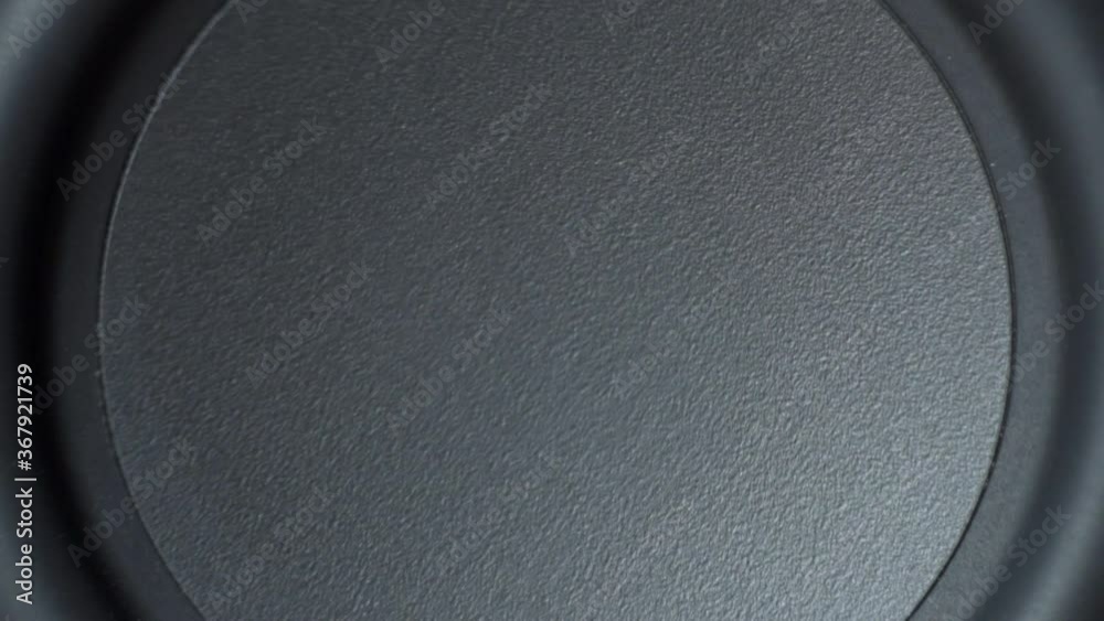 Vidéo Stock Subwoofer playing music at a high volume, close up and face ...