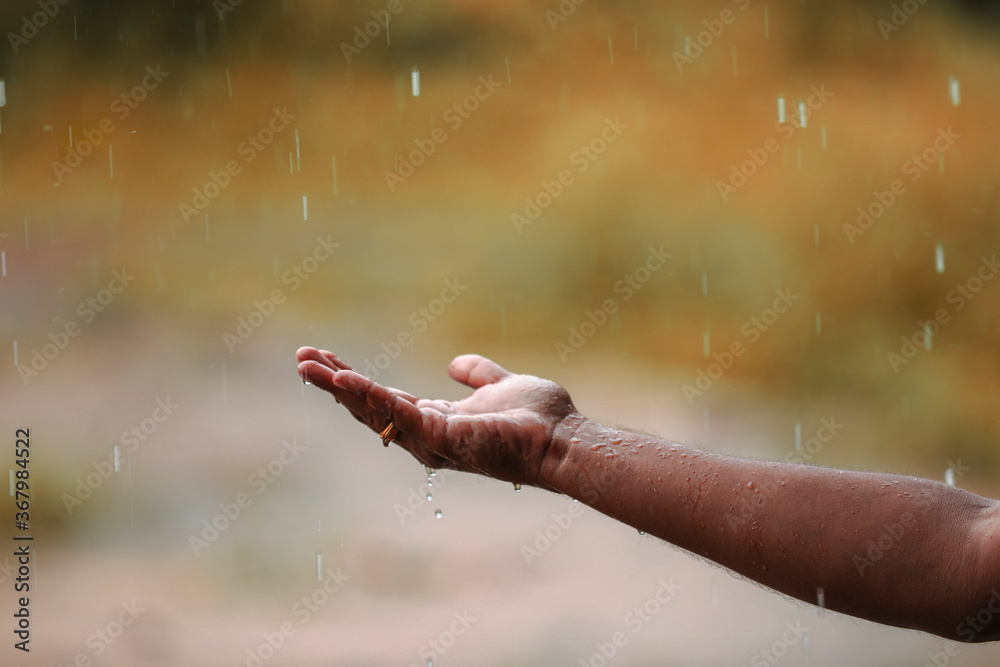 Rain Falling On A Hand