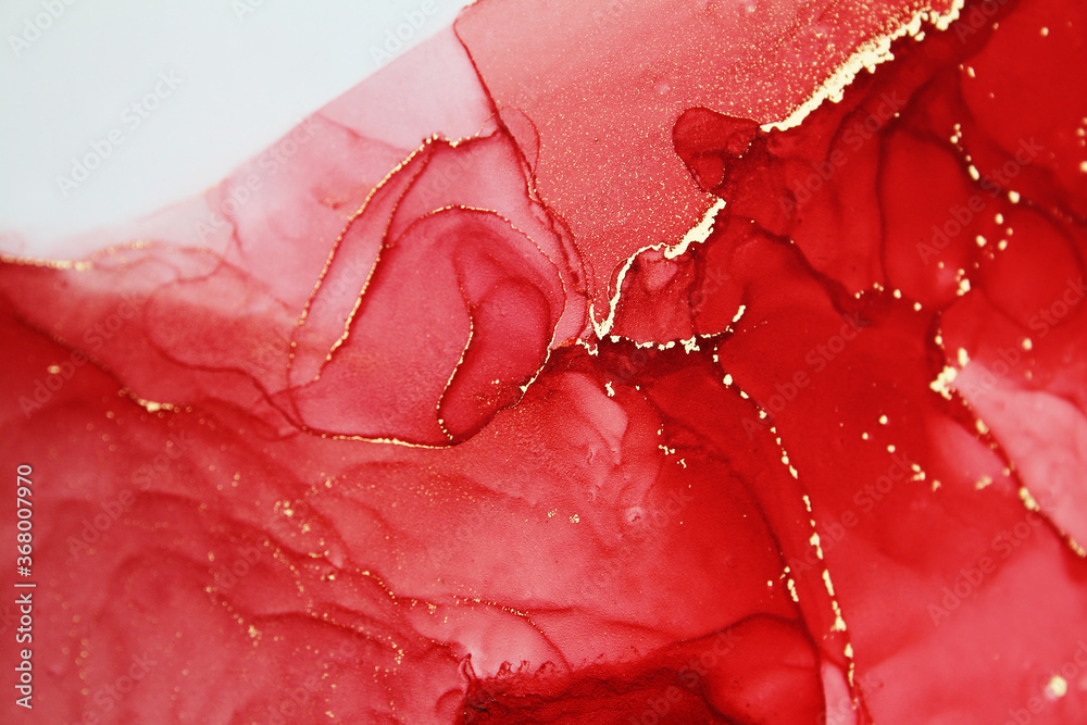 Luxury abstract fluid art background alcohol ink technique red and gold ...