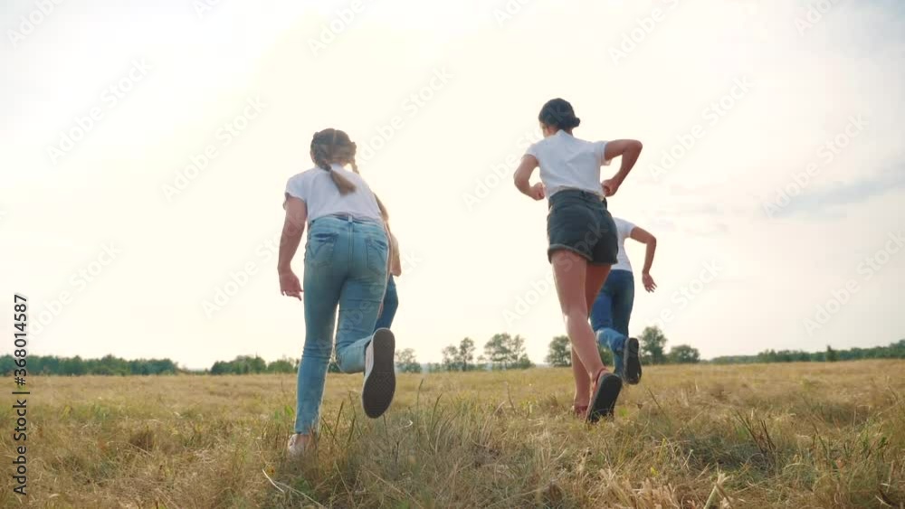 Video Stock happy family children kids together run in park at sunset ...