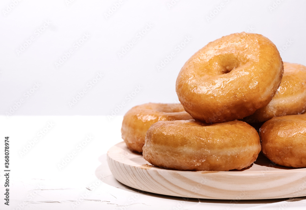 wooden tray with many doughnuts on a white background Stock Photo ...