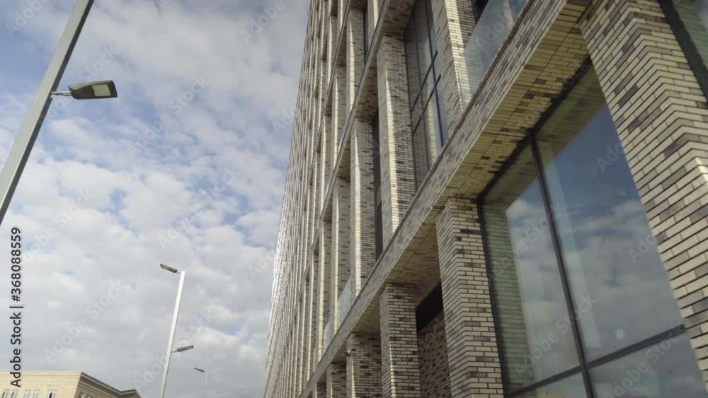 the facade of brick high-rise apartment buildings with stained glass ...