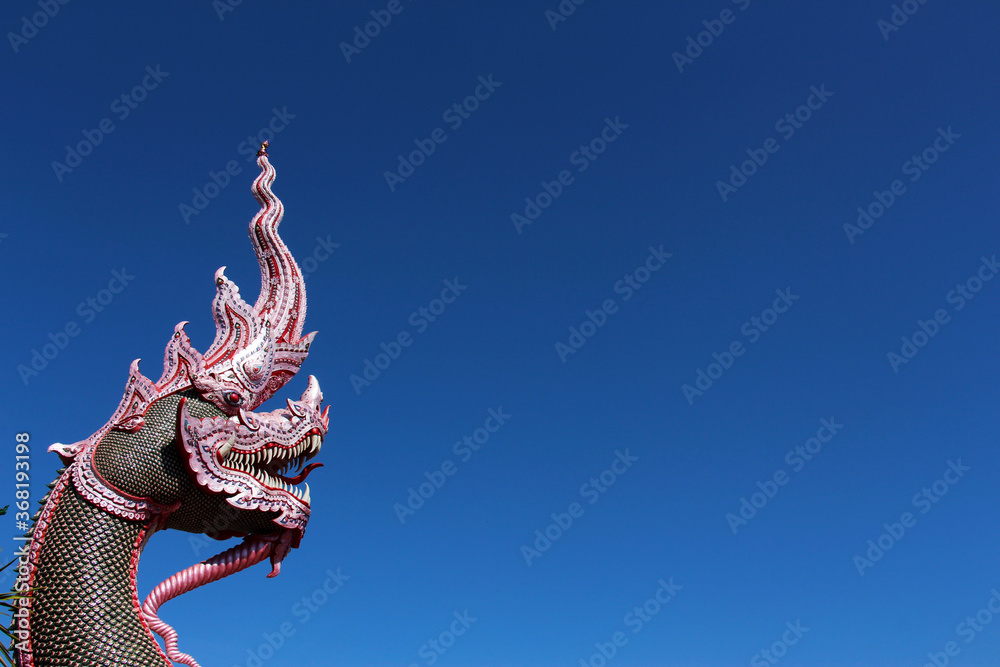 Phaya Nak statue (Naga guarding) or "King of naga" It is commonly seen ...