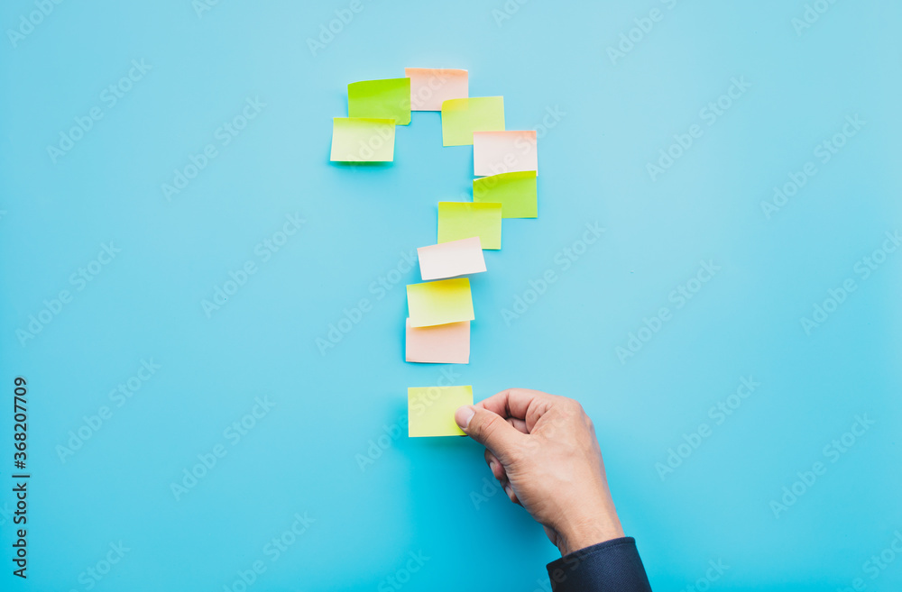 Question and answer or thinking ideas concepts with male hand holding ...