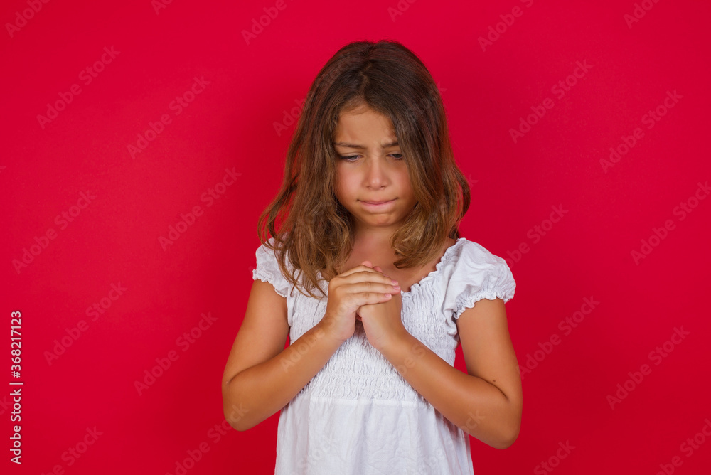 beautiful face of sad Little caucasian girl with blue eyes desperate ...