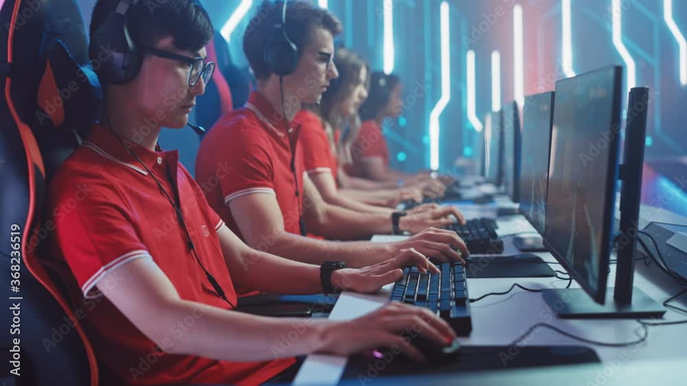 Diverse Esport Team of Pro Gamers Play in Mock-up FPS Shooter Video ...