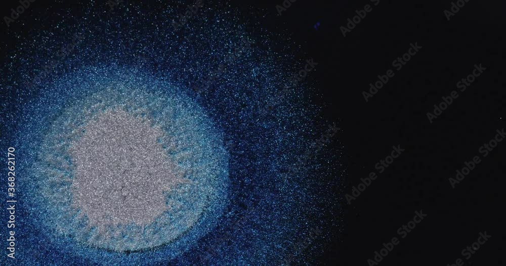 Silver, Blue, and White sun solar flare reaction with liquid ink ...