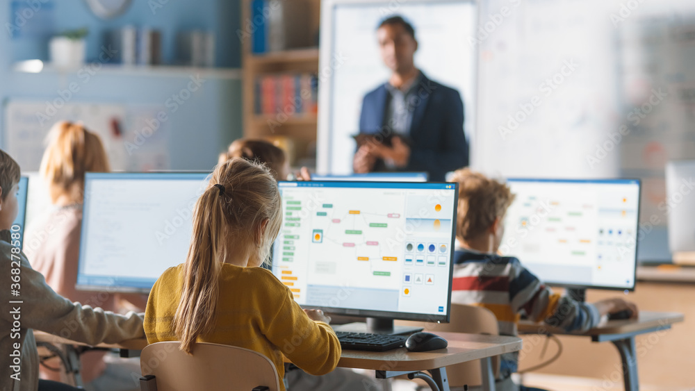 Elementary School Computer Science Class: Teacher Uses Digital Tablet ...