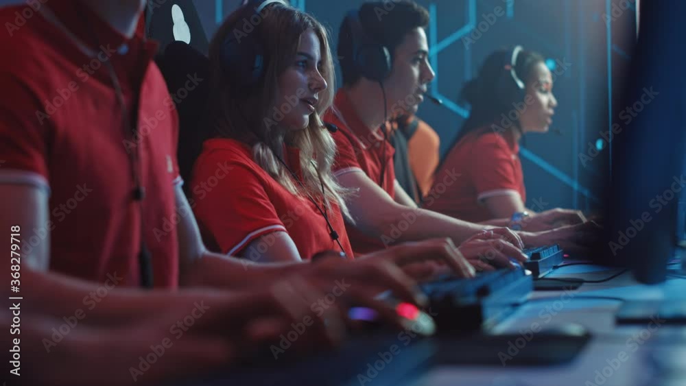 Diverse Esport Team of Pro Gamers Play in Video Game on a Championship ...