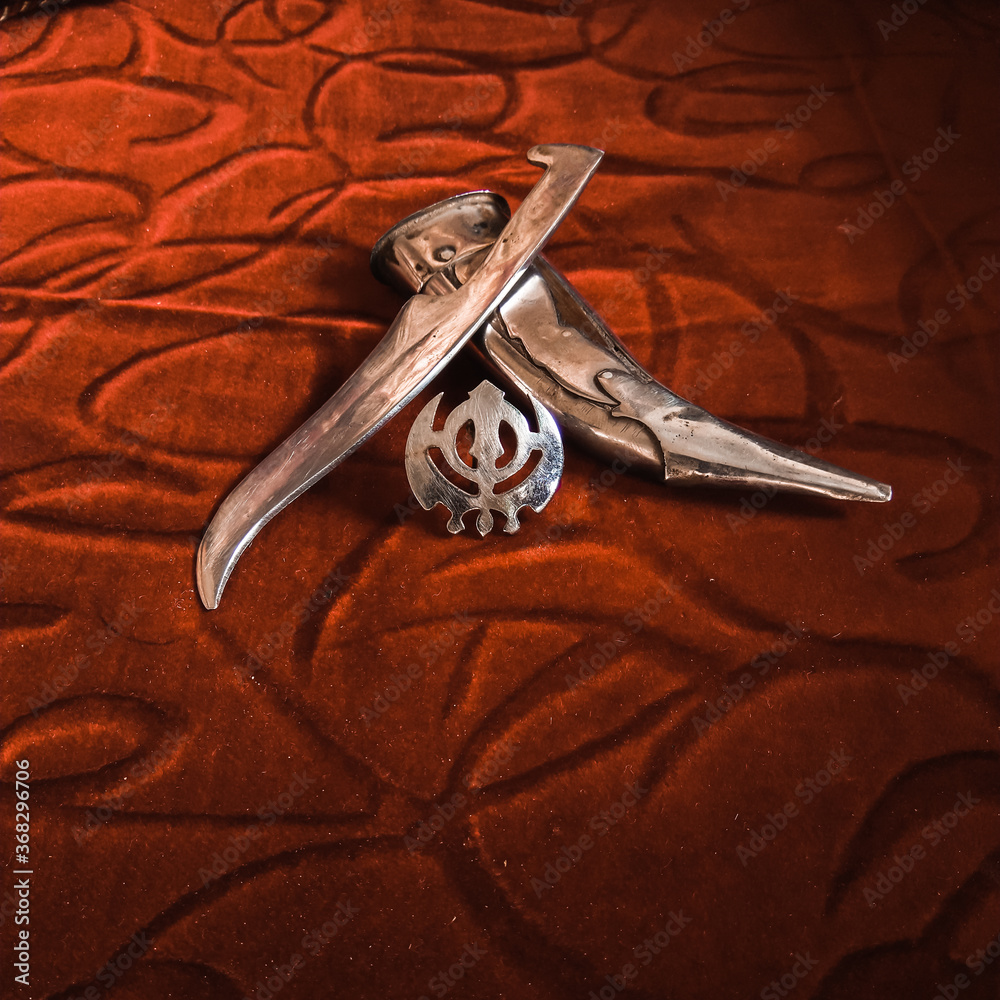 Knife with scabbard and khalsa monogram. The khalsa monogram is a ...